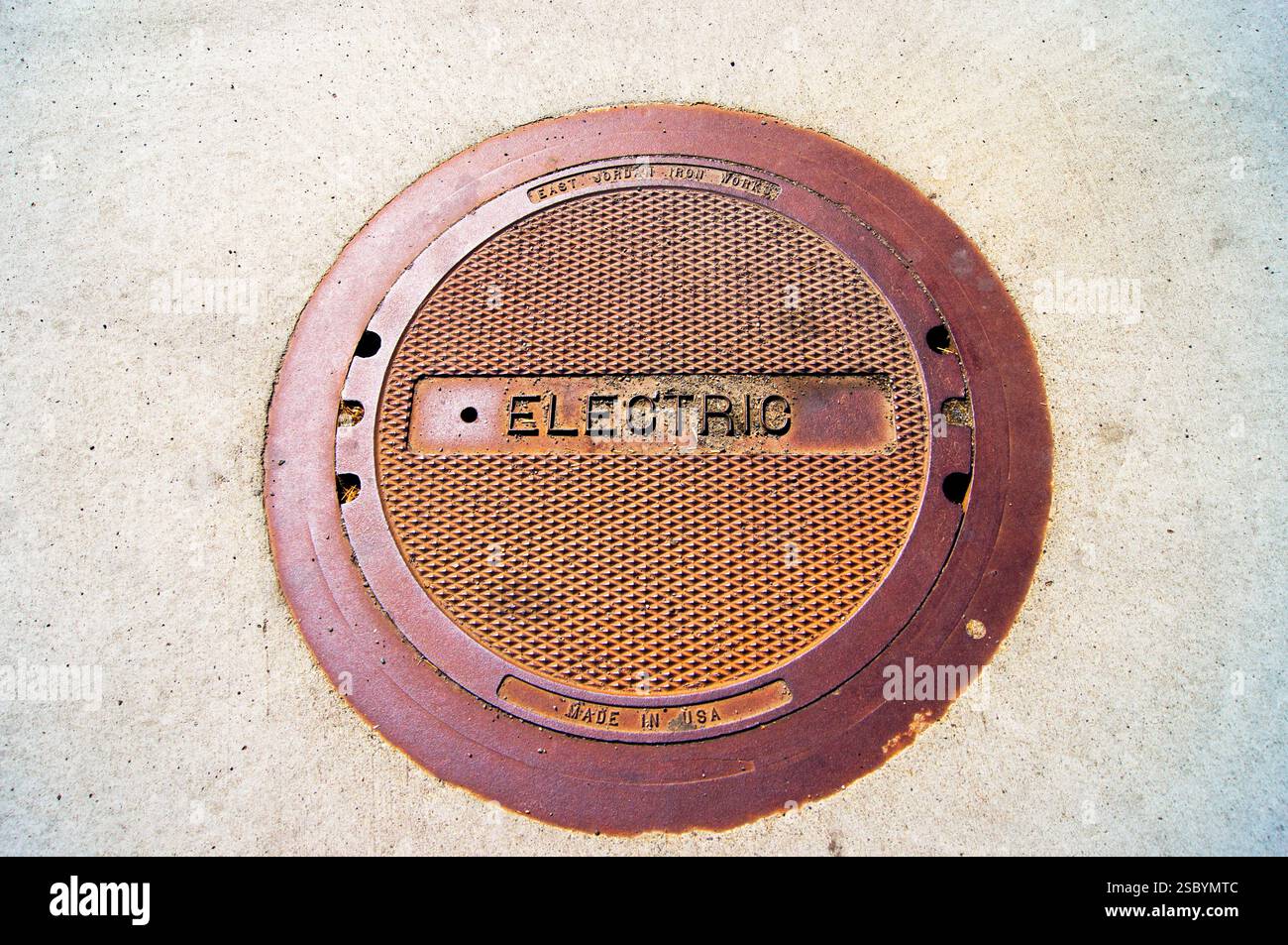 A metal manhole cover in Seattle, Washington, USA. The design comprises ...