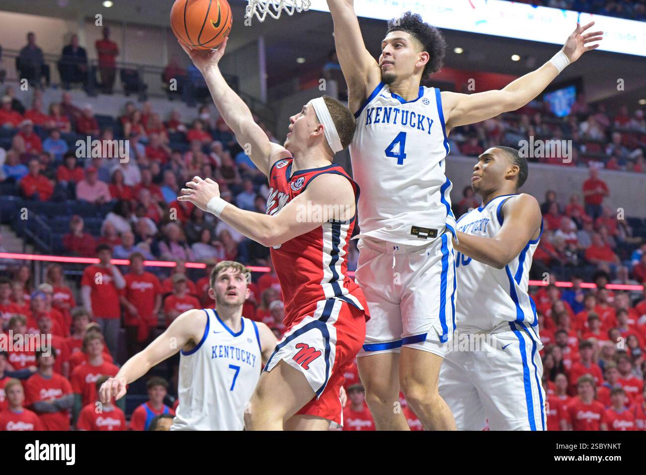 Mississippi guard Sean Pedulla (3) scores past Kentucky forward Andrew ...