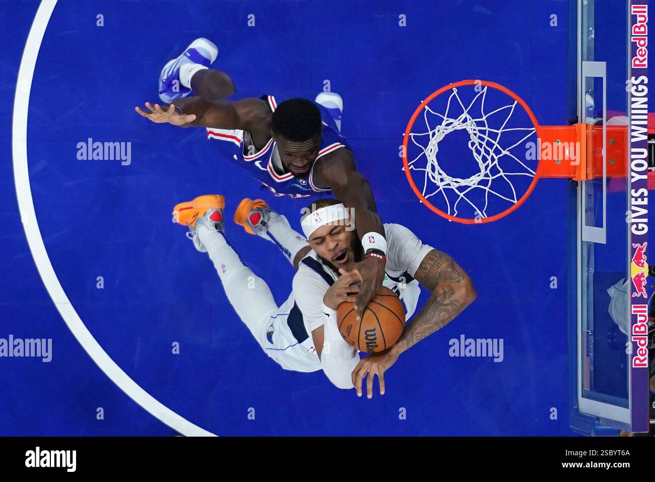 Dallas Mavericks' Daniel Gafford, bottom, cannot get a shot past ...