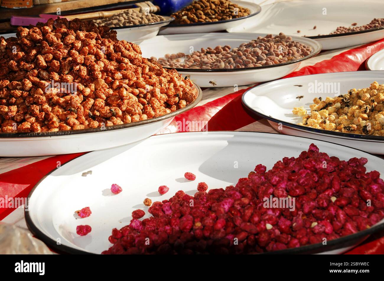 Various nuts and dried fruit in bowls, atmospheric market stall ...