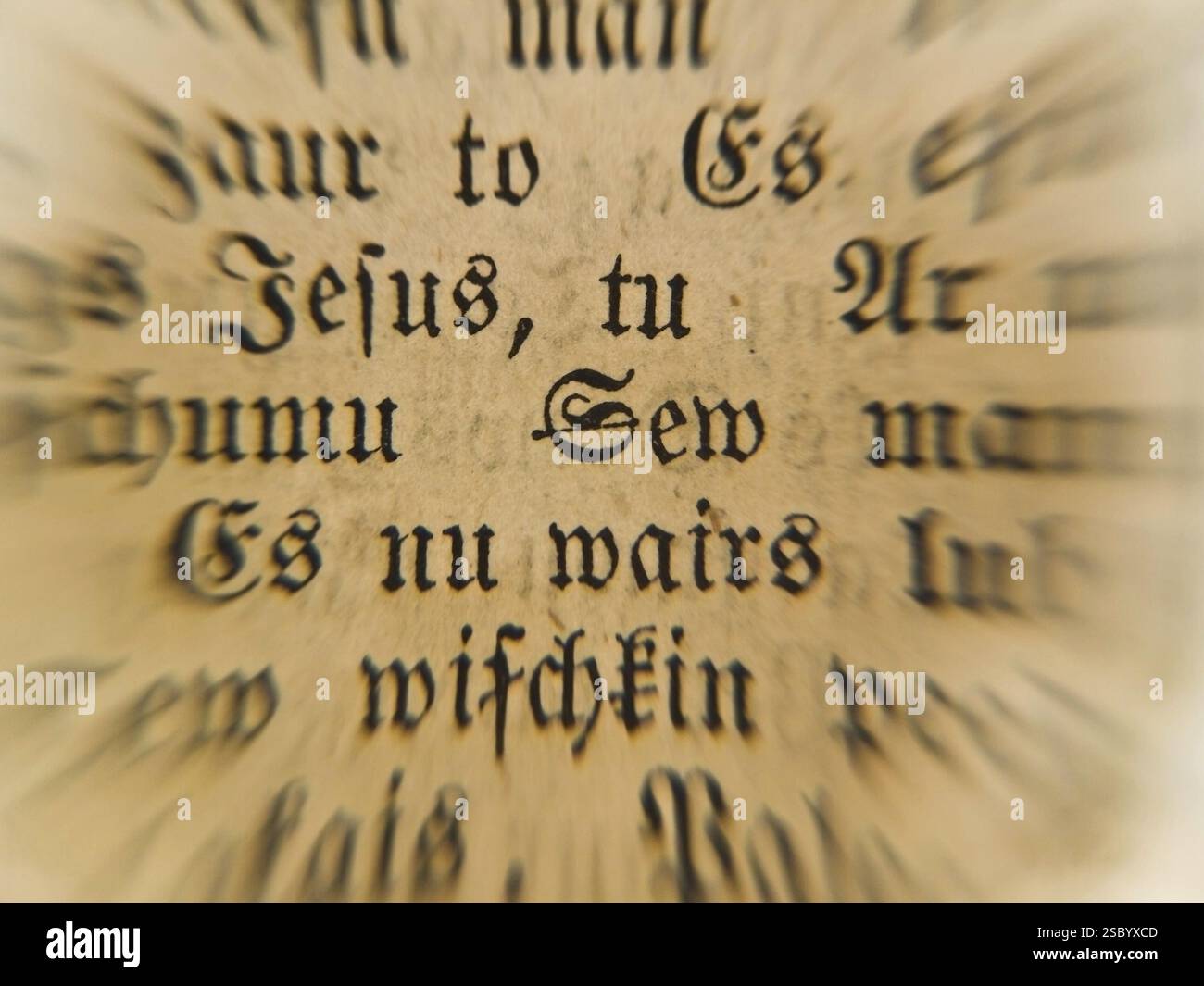 Old Bible Text Under The Magnifying Glass Stock Photo - Alamy