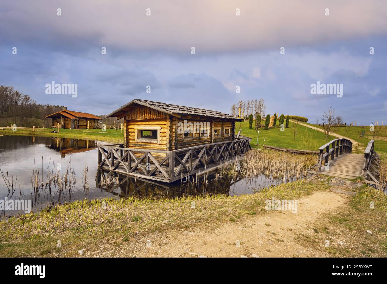Old wooden cabin on the water Aglona, Latvia, Europe Stock Photo - Alamy