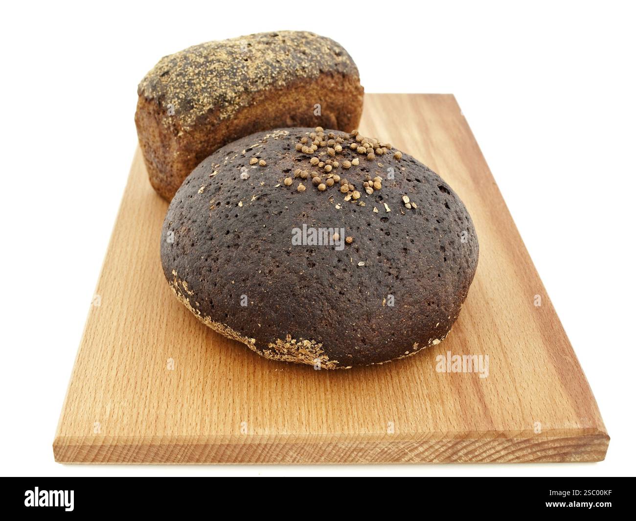 Two Pieces Of Handmade Bread At Breadboard Against White Background ...