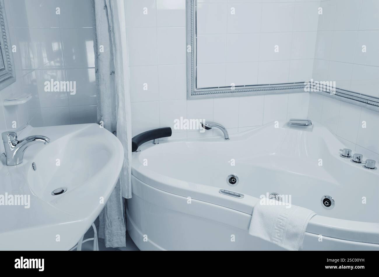 White Modern Bathroom With Sink And Jacuzzi Stock Photo - Alamy