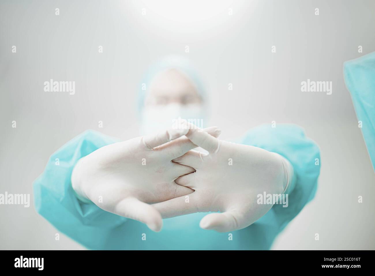 Clasped hands in gloves hi-res stock photography and images - Alamy