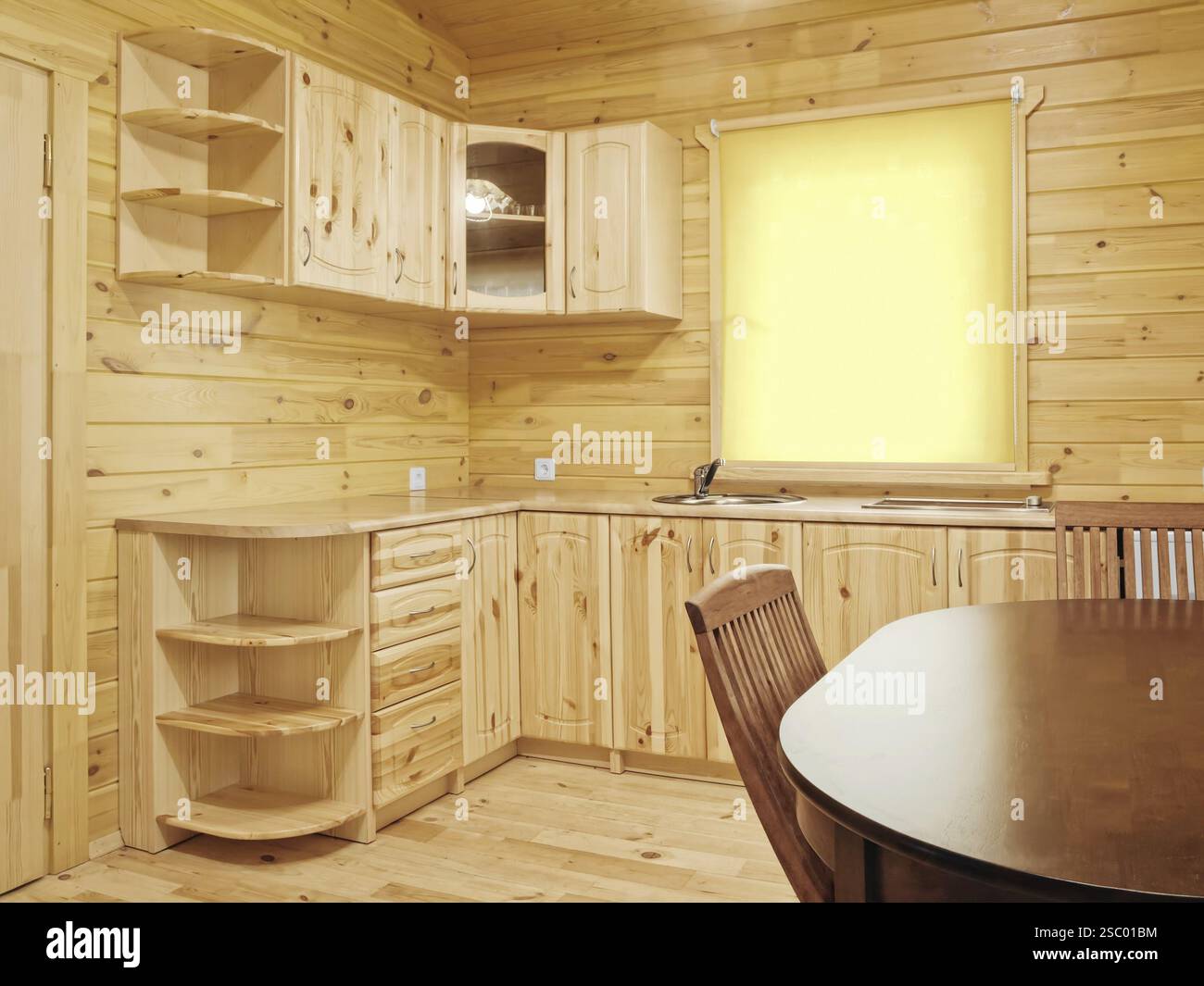 Interior of the kitchen in a wooden blockhouse Stock Photo - Alamy