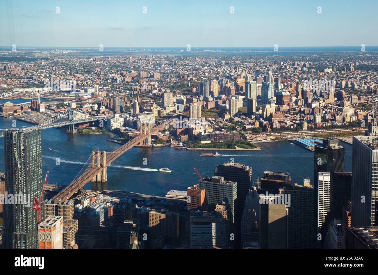 The Financial district, Manhattan and Brooklyn bridges over the Hudson river and Brooklyn, New ...