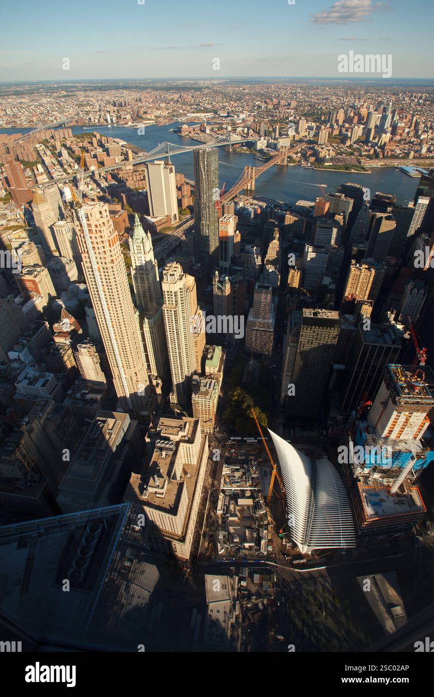 The Financial district, Manhattan, Brooklyn and Williamsburg bridges over the Hudson river and ...