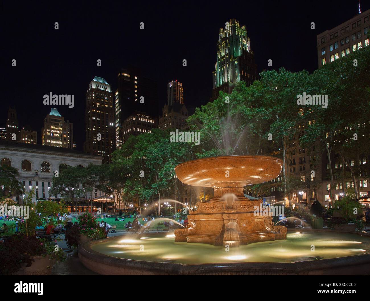The Bryant park fountain, the American Radiator historic building and ...