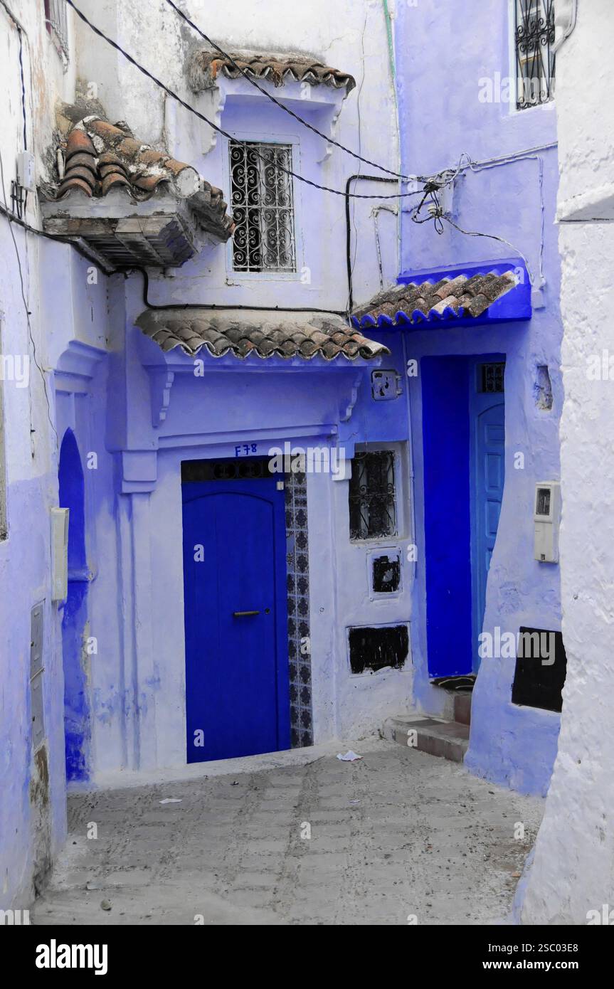 Chefchaouen, Rif Mountains, Morocco, Narrow alley with houses in shades ...