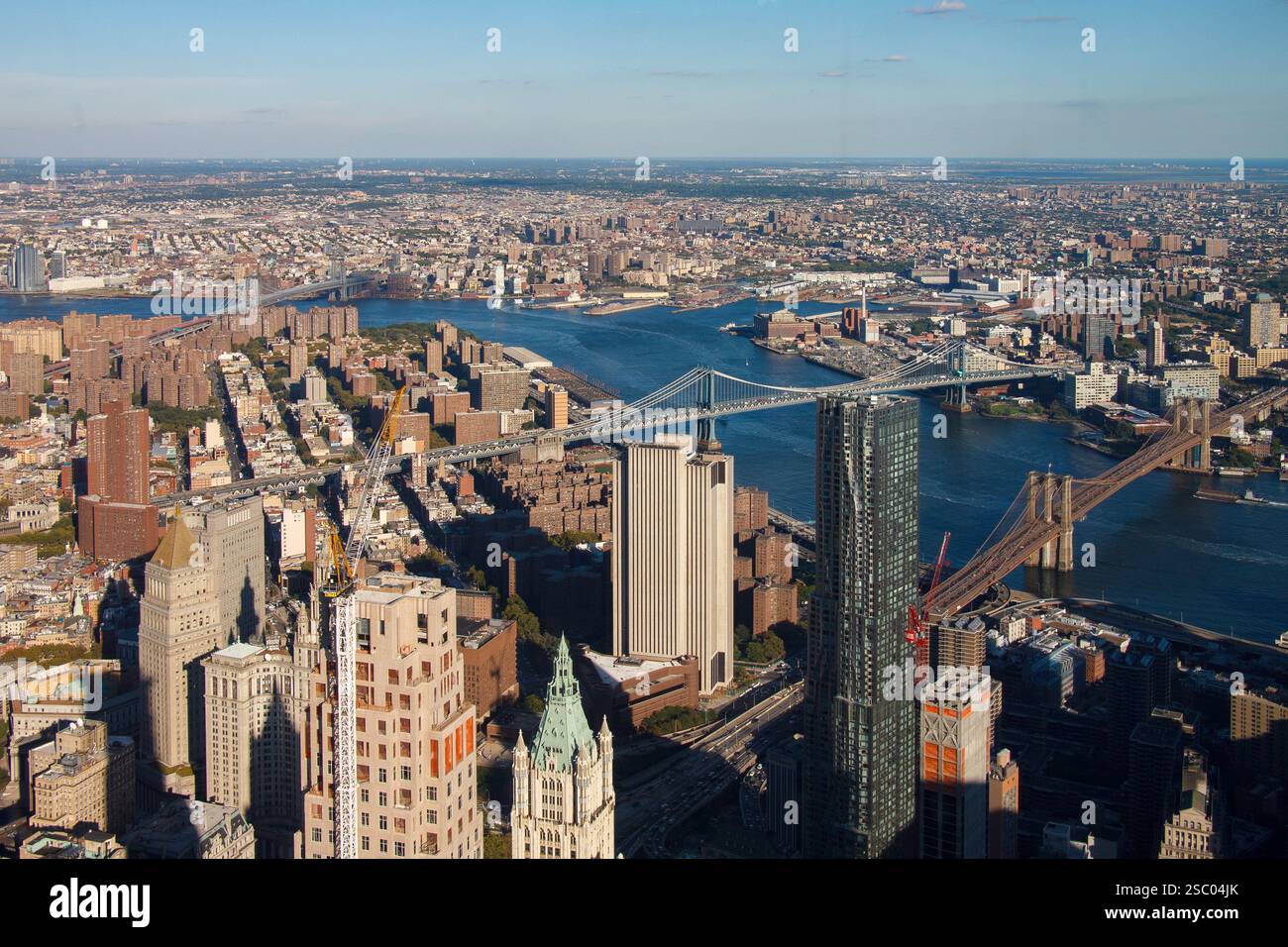 The Financial district, Manhattan, Brooklyn and Williamsburg bridges over the Hudson river and ...