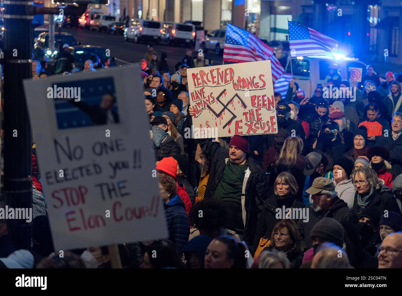 People protest during a rally against Elon Musk outside the Treasury ...