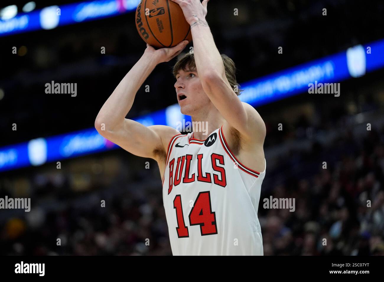 Chicago Bulls forward Matas Buzelis (14) sinks a three-point shot during the second half of an ...