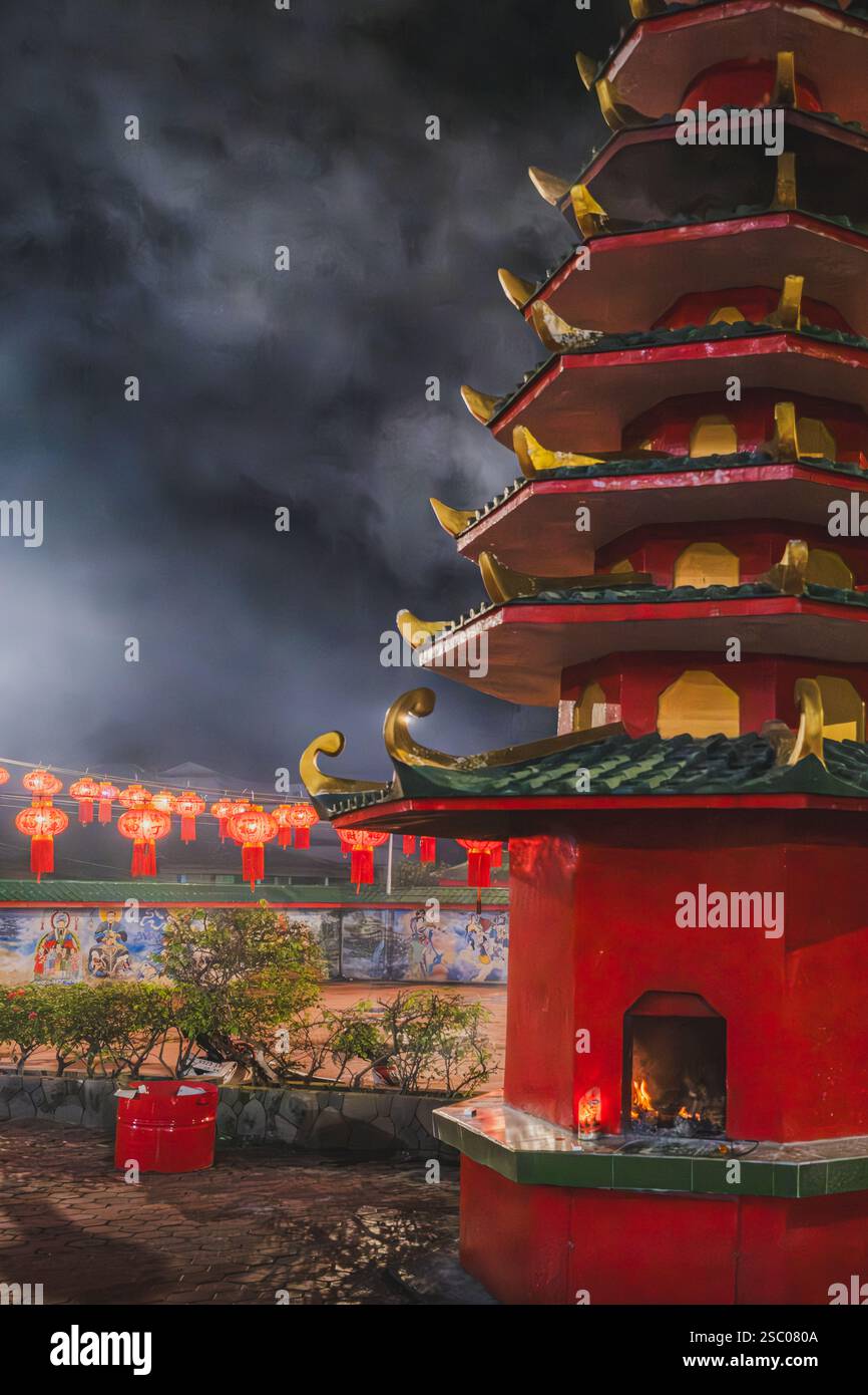 Balikpapan, Indonesia - January 28th, 2025. The pagoda emits smoke from ...