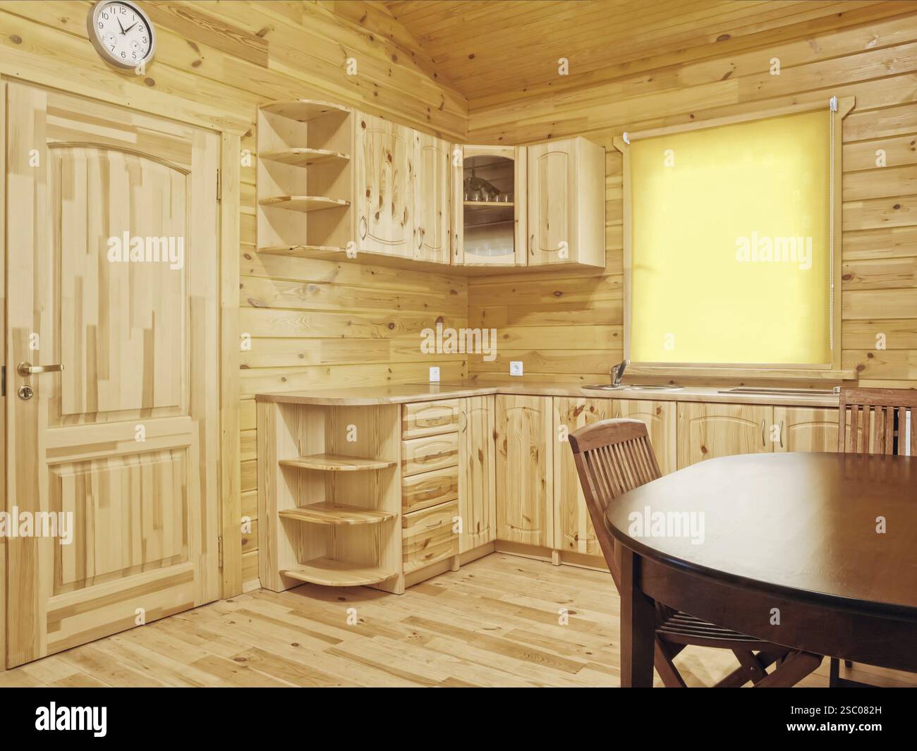 Interior of the kitchen in a wooden blockhouse Stock Photo - Alamy