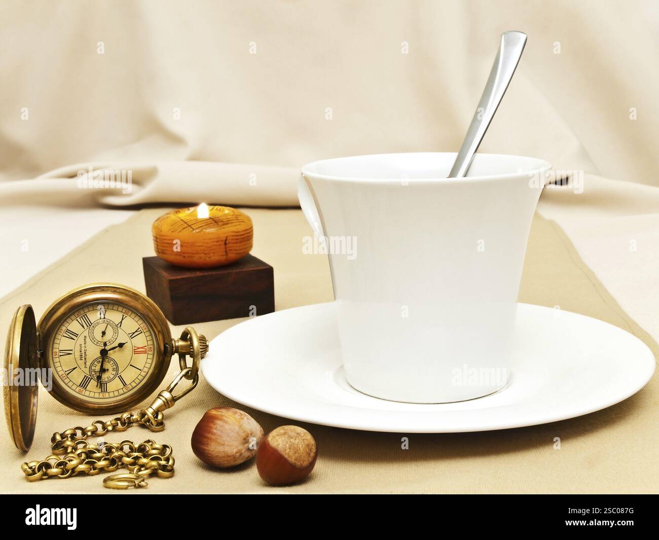 Original Decorated Table Serving With Candle, Nuts And Old Pocket Watch ...