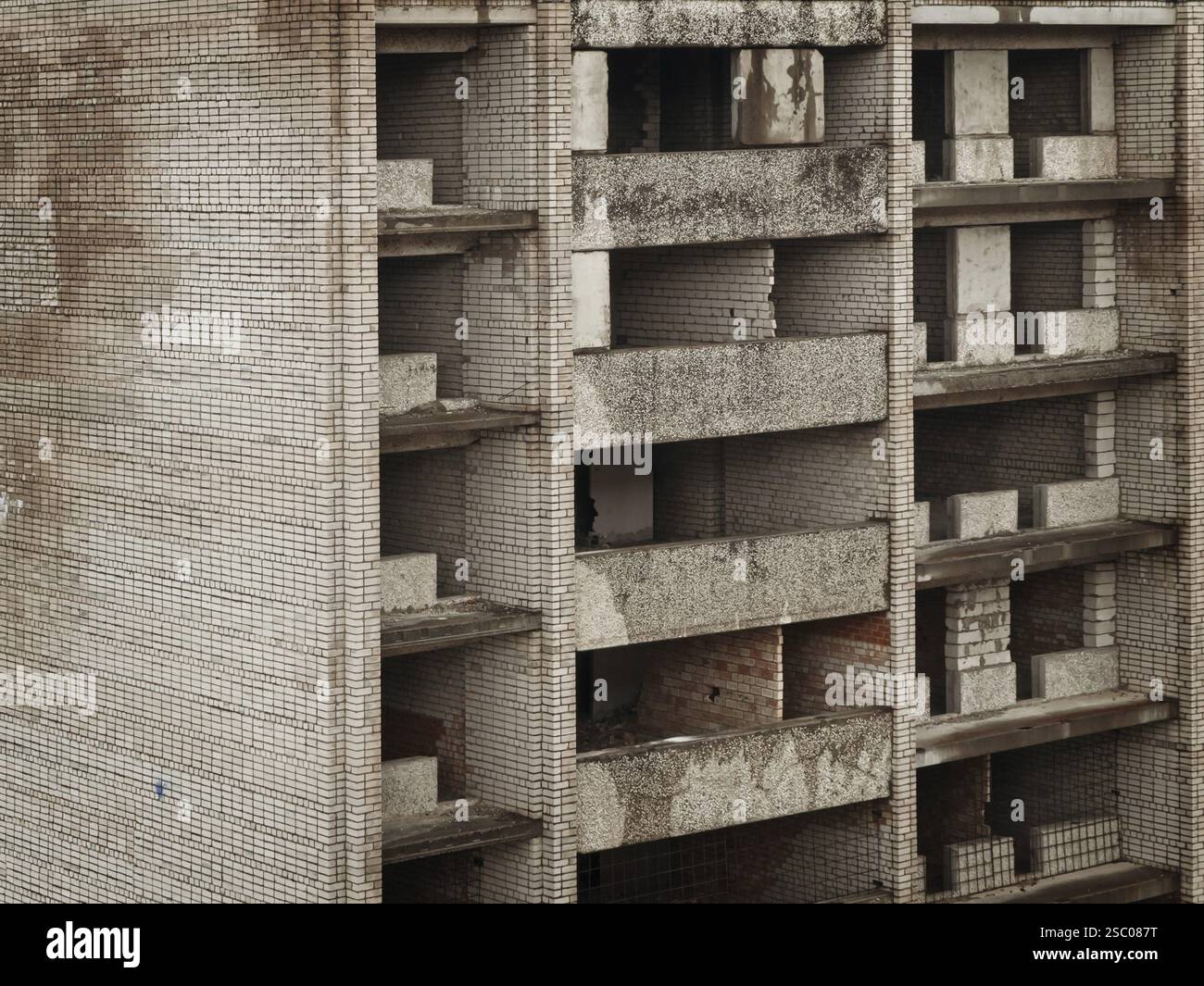 Suspended brick building with apertures for windows and loggias Stock ...