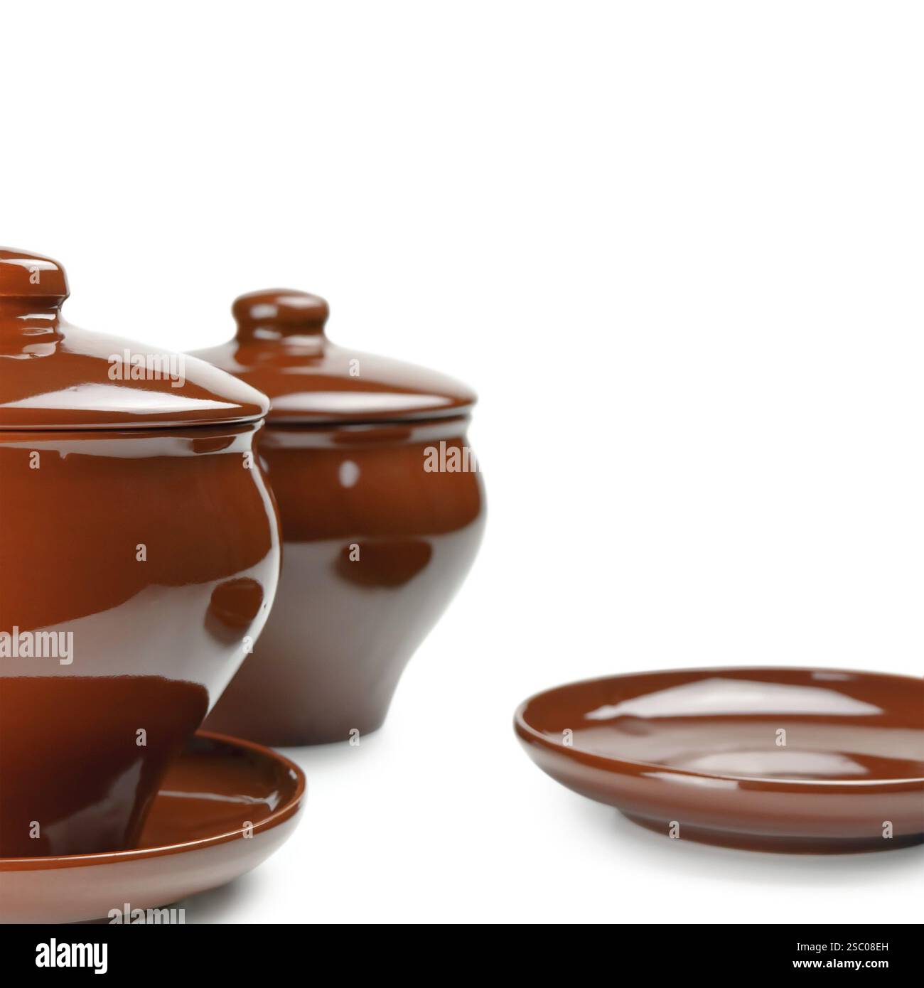Brown ceramic pot over the white background Stock Photo - Alamy