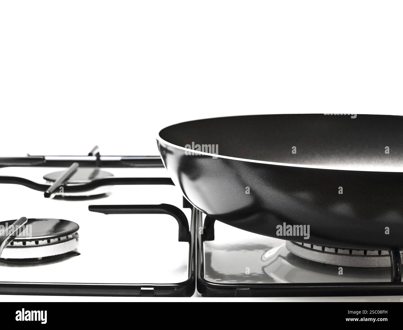 Frying Pan At The White Gas Stove Over The White Background Stock Photo ...