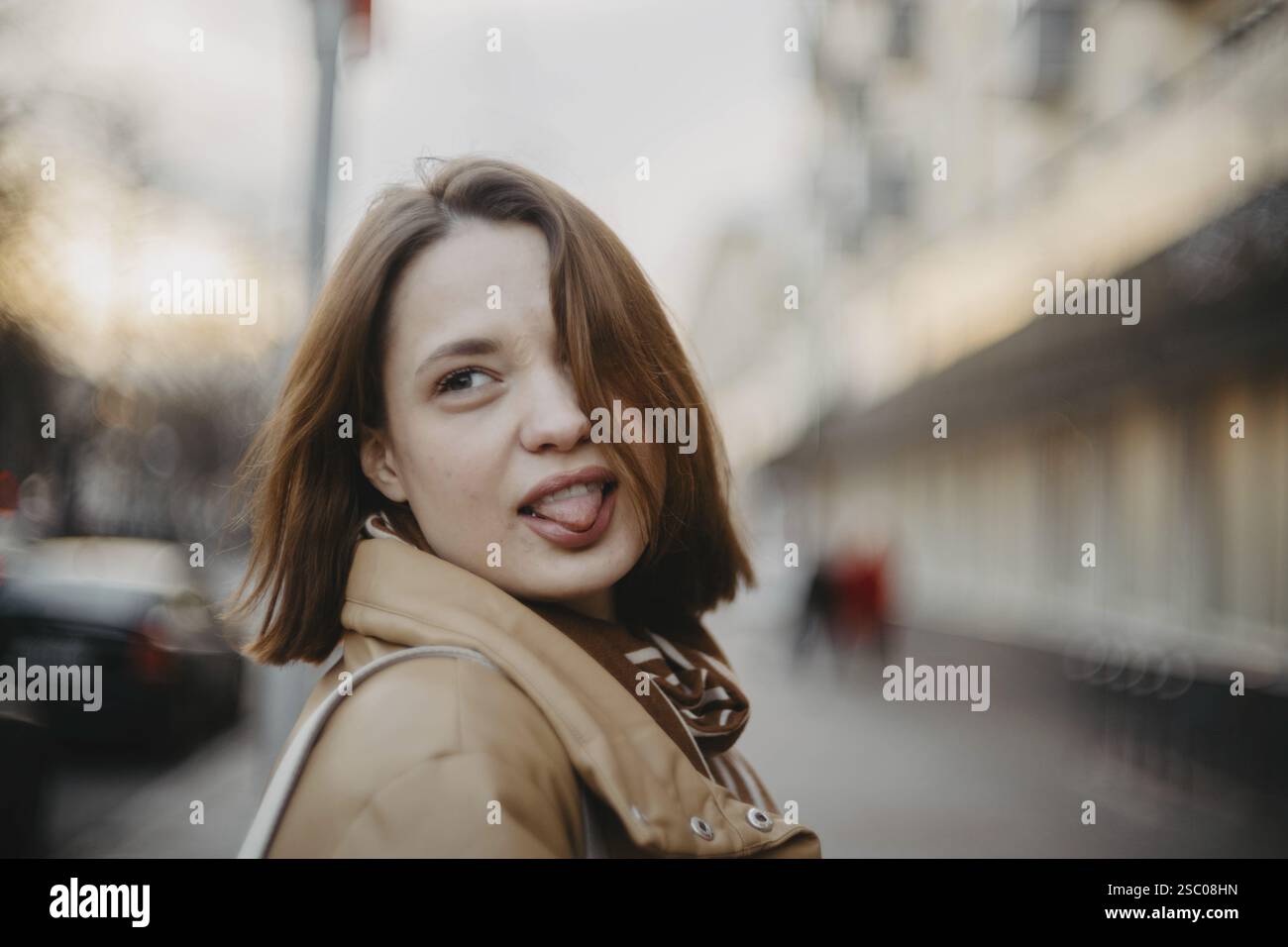 Woman playfully sticking tongue hi-res stock photography and images - Alamy