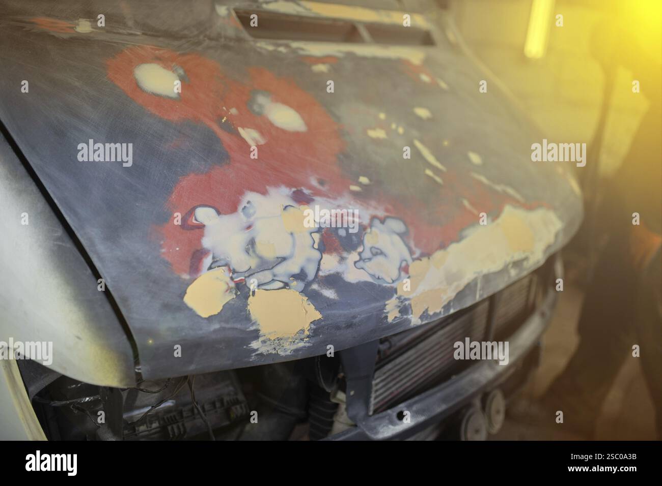 Car hood with repair marks, illuminated by sunlight Stock Photo - Alamy