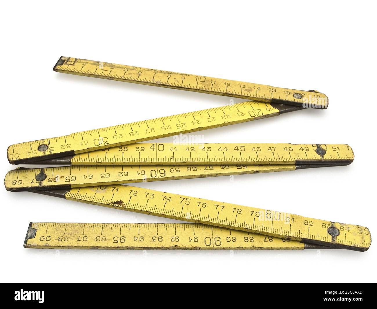 Old yellow wooden meter over the white background Stock Photo - Alamy