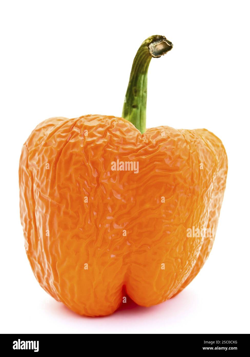 Old wrinkled orange paprika over the white background Stock Photo - Alamy