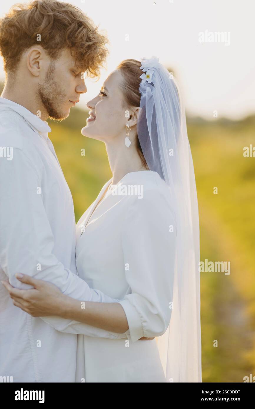 A couple shares a warm embrace, filled with affectionate smiles and a ...