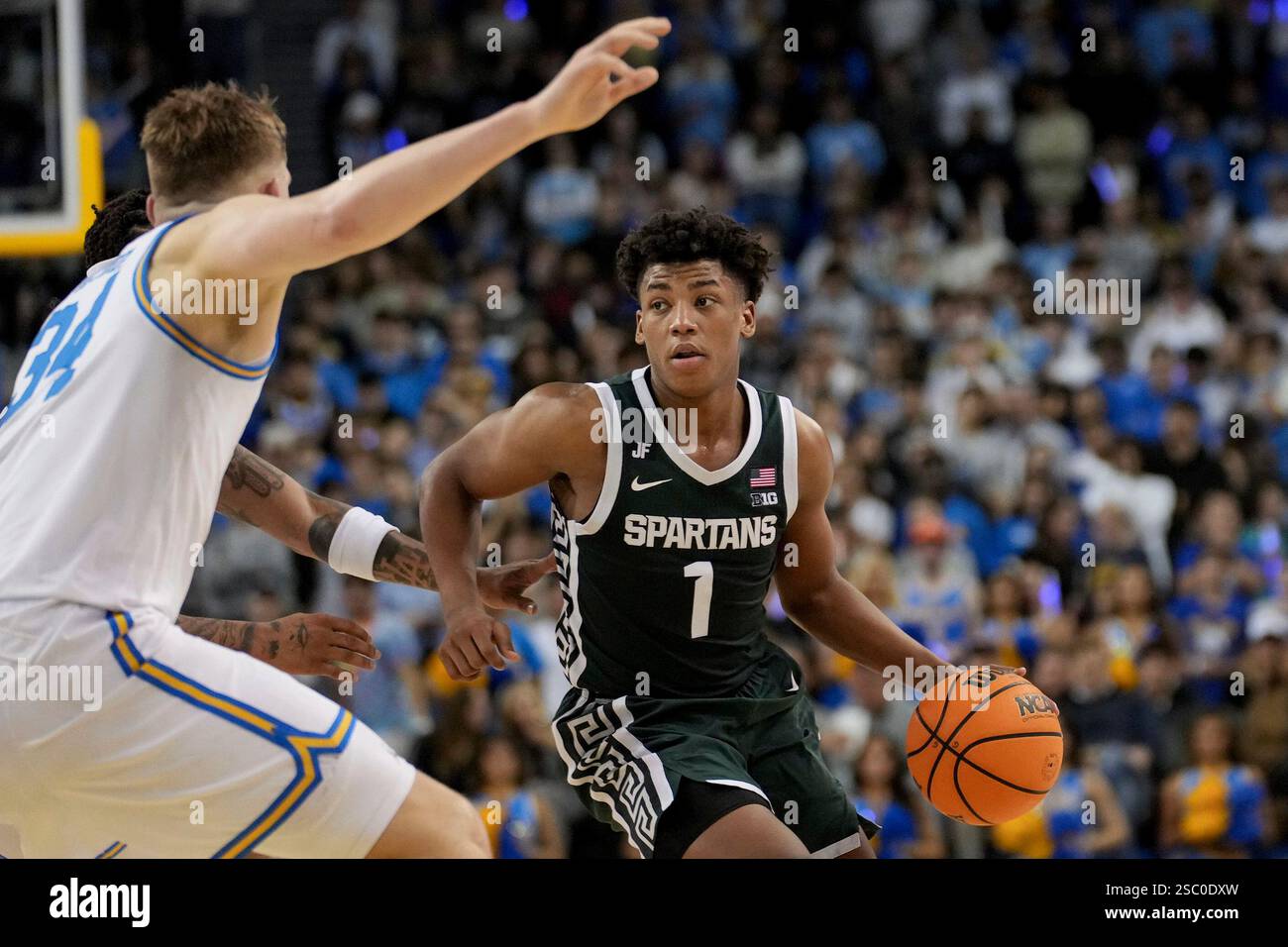 Michigan State guard Jeremy Fears Jr. (1) dribbles against UCLA forward ...