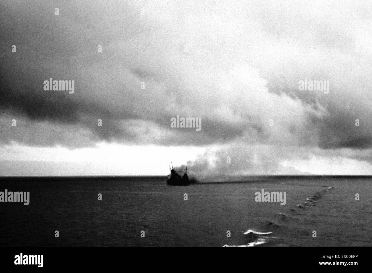 HMAS Canberra (D33) burning and sinking on 9 August 1942 Stock Photo ...