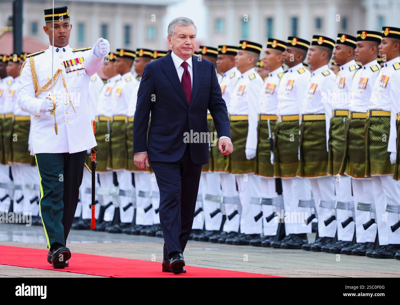 Uzbekistan President Shavkat Mirziyoyev inspects an honor guard during ...