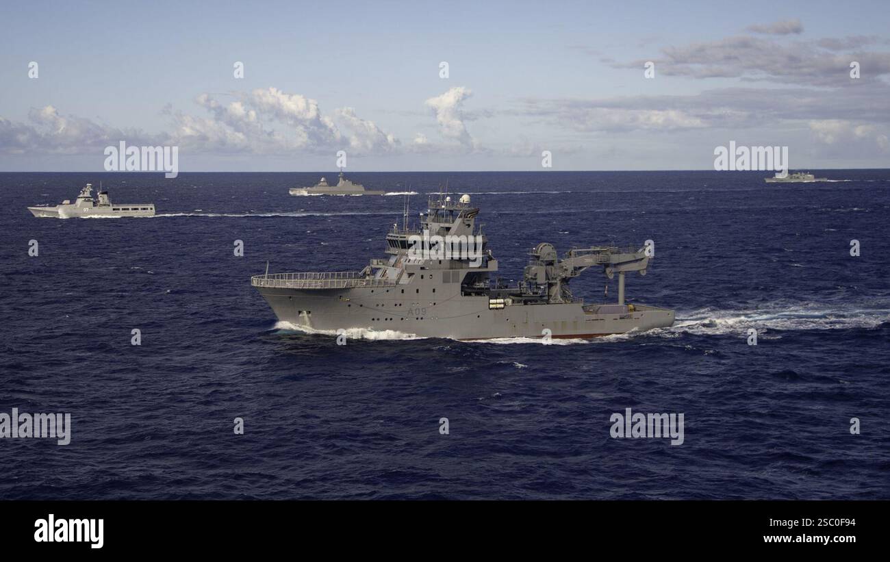 HMNZS Manawanui (A09) maneuver in formation with other navy ships of ...