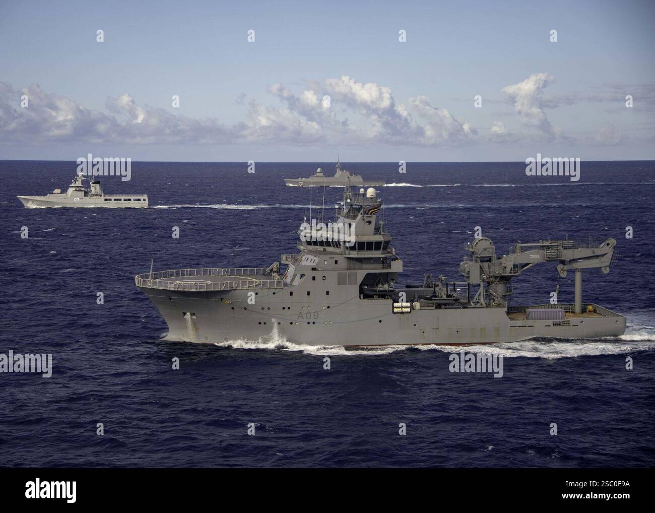 HMNZS Manawanui (A09) maneuver in formation with other navy ships of ...