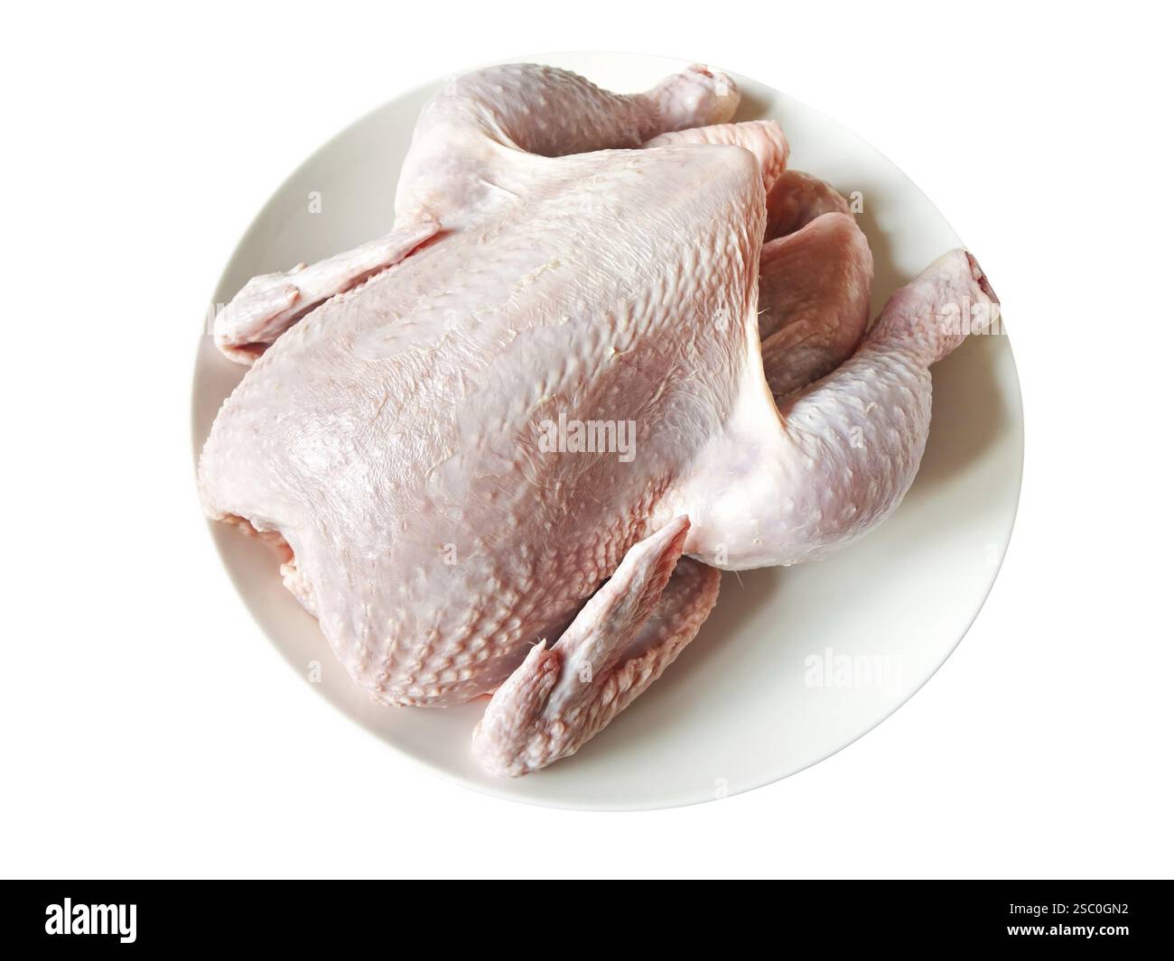 Photo of uncooked chicken over white background Stock Photo - Alamy