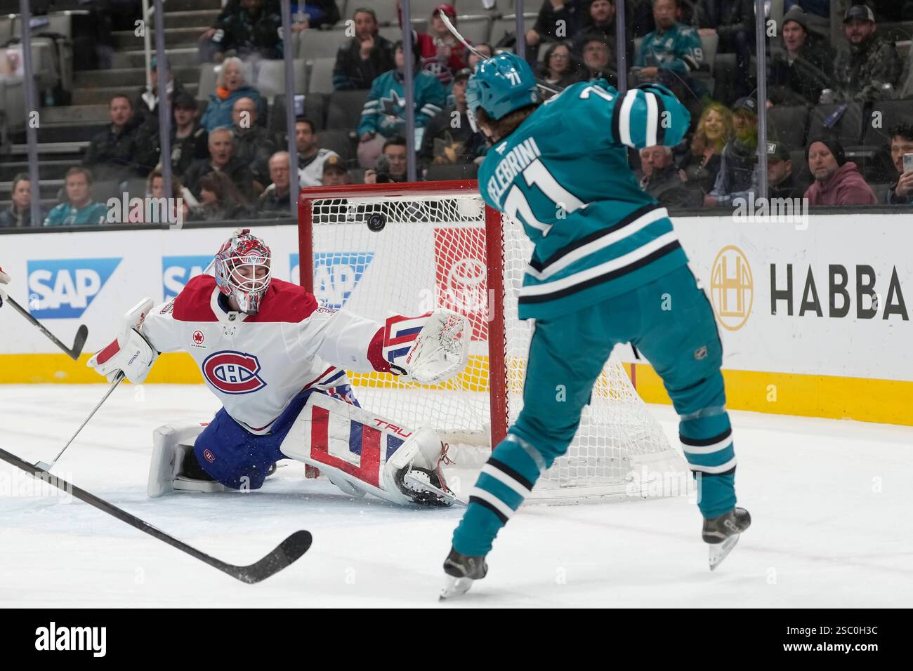 San Jose Sharks center Macklin Celebrini, right, scores a goal past ...