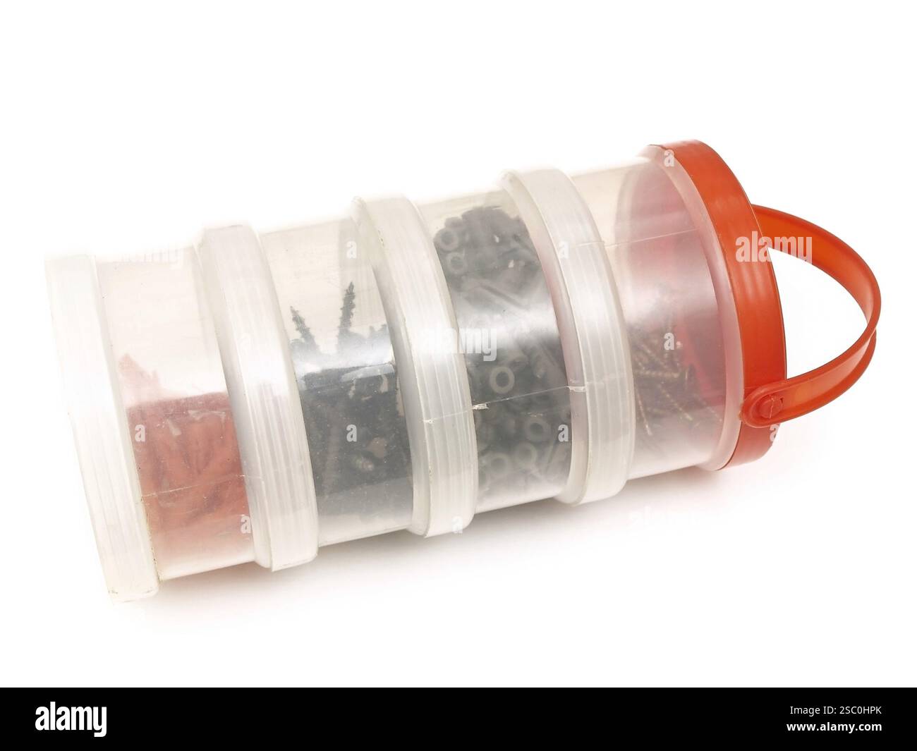 Dowel pins ang bolts in plastic containers against the white background ...
