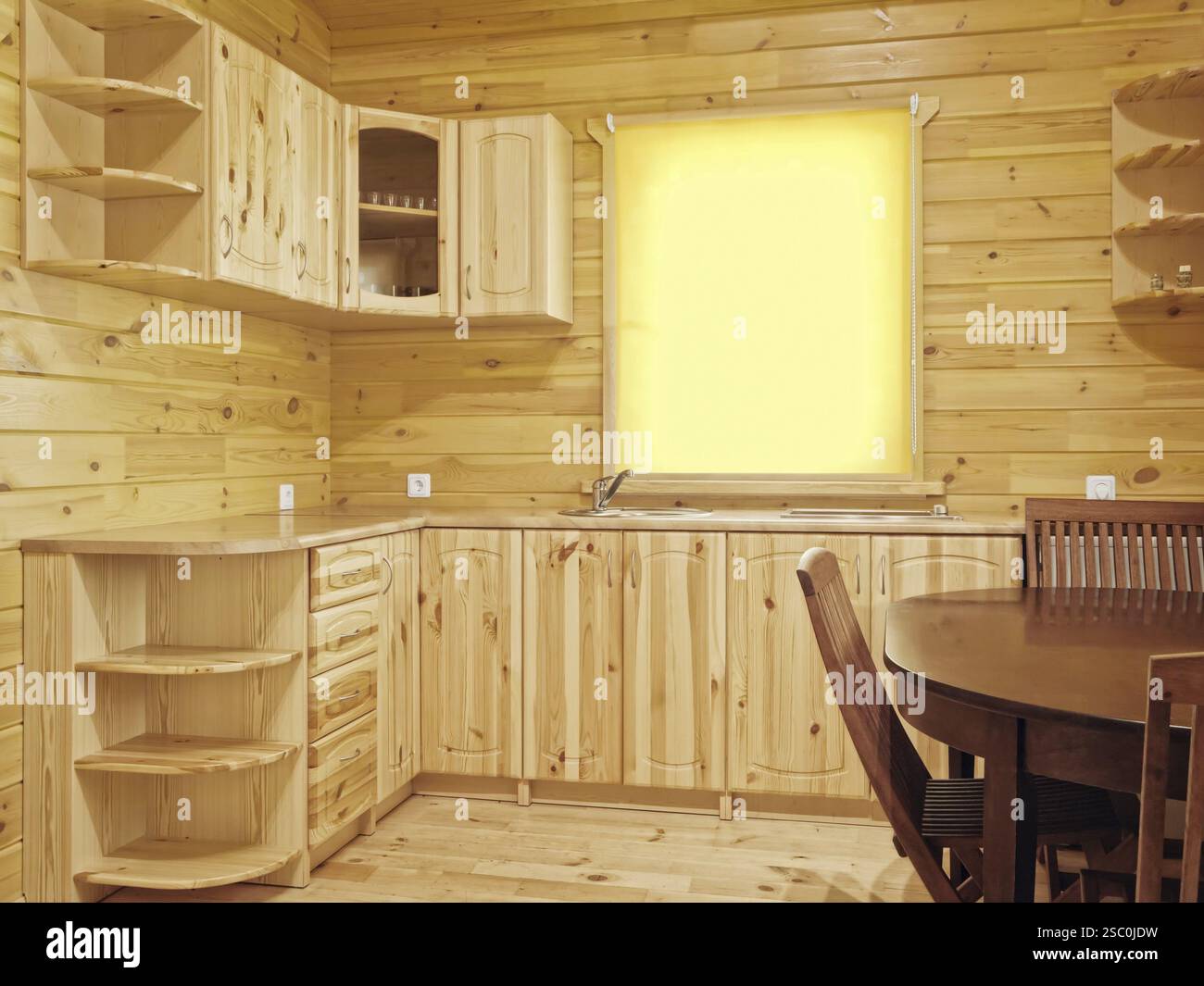 Interior of the kitchen in a wooden blockhouse Stock Photo - Alamy