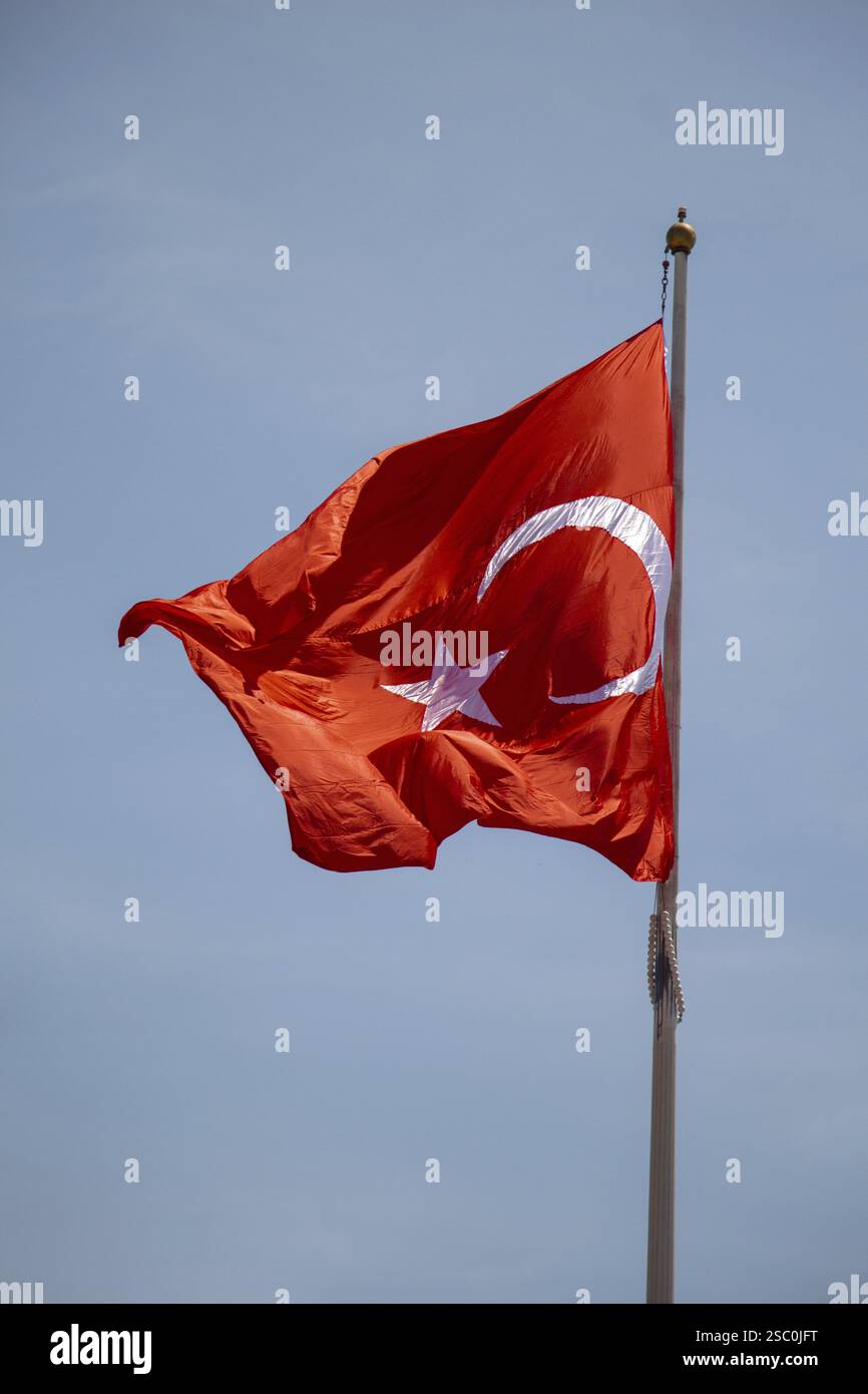 Turkish national flag with white star and moon on a pole in sky Stock ...