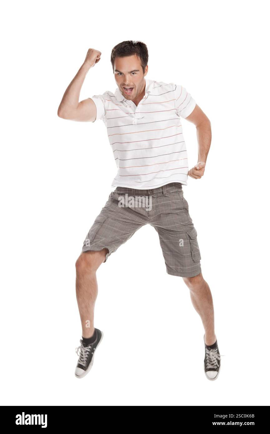 Young happy man jumping on a white background Stock Photo - Alamy