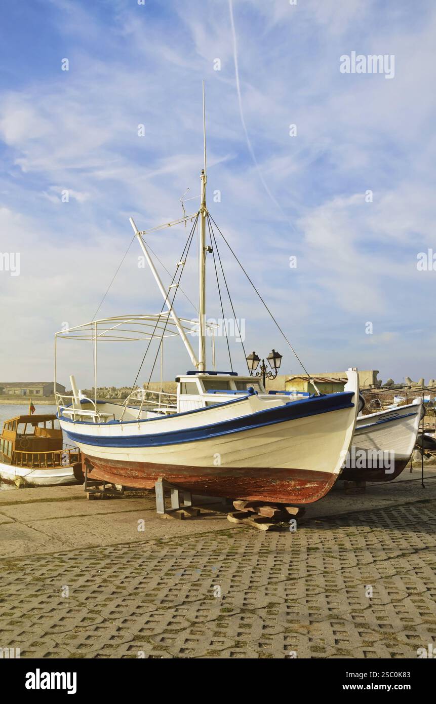 Boats On The Shore In The Fishing Port Stock Photo - Alamy