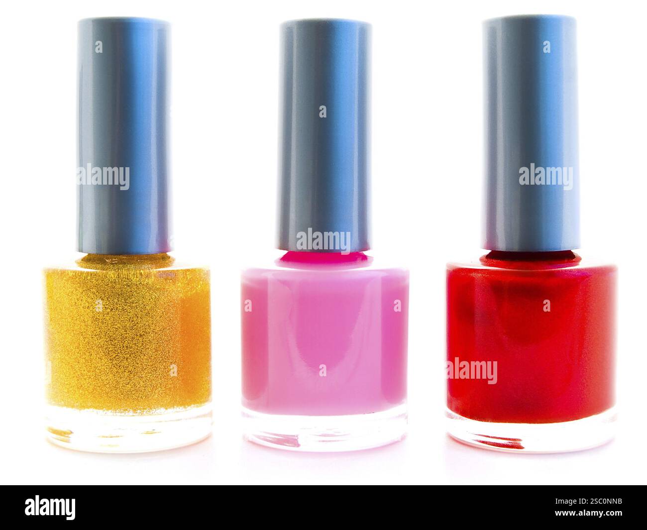 Different color nail varnish bottles over white Stock Photo - Alamy