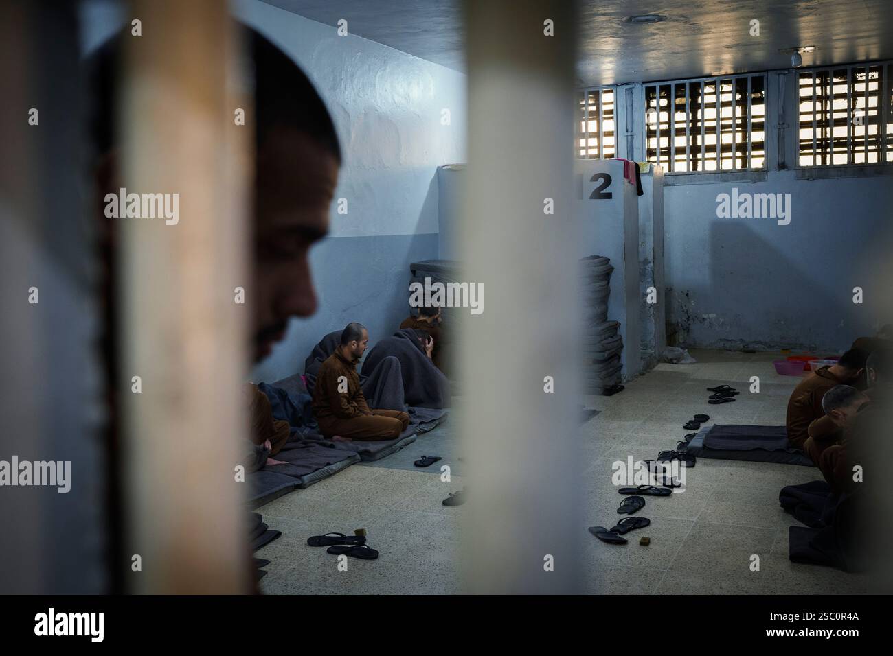 Inmates accused of being an Islamic State (ISIS) fighters sit inside a ...