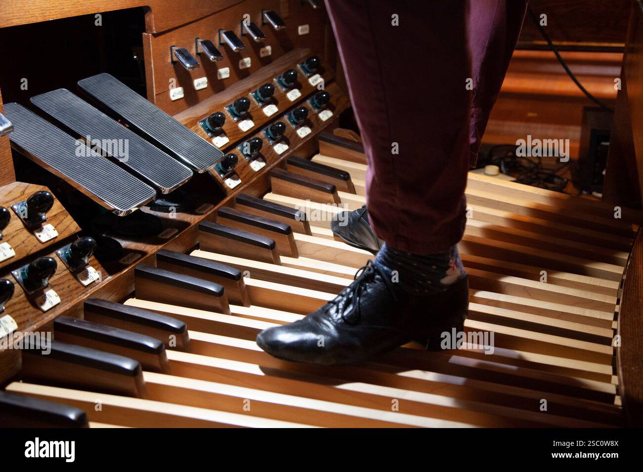 Wearing custom, form-fitting shoes, Colin MacKnight demonstrates how ...