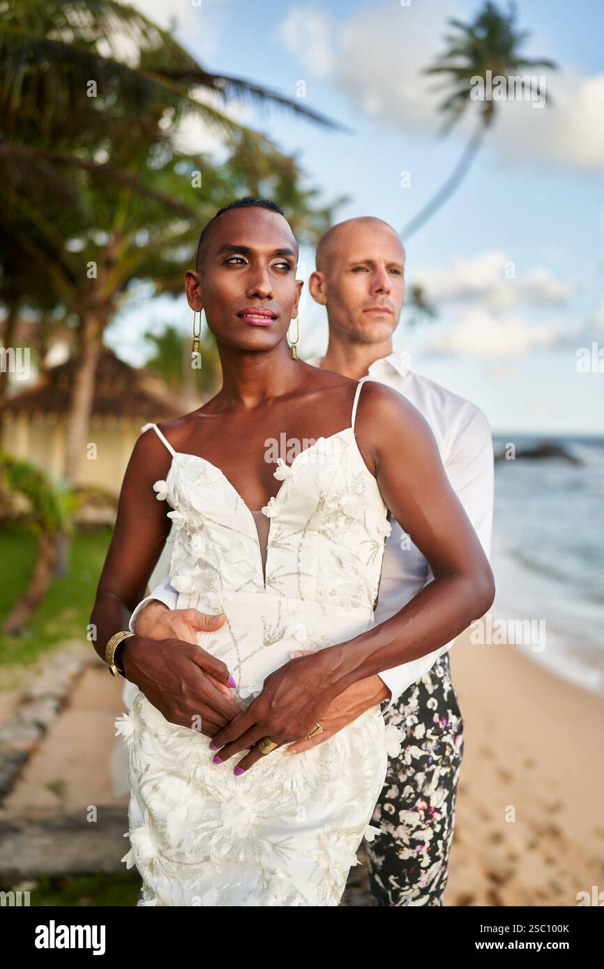 Ambiguous person, white dress, partner, bold suit tropical beach ...