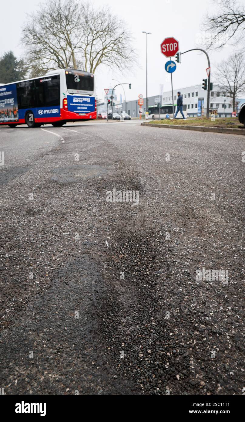 Hamburg, Germany. 04th Feb, 2025. Potholes and road damage on a side ...
