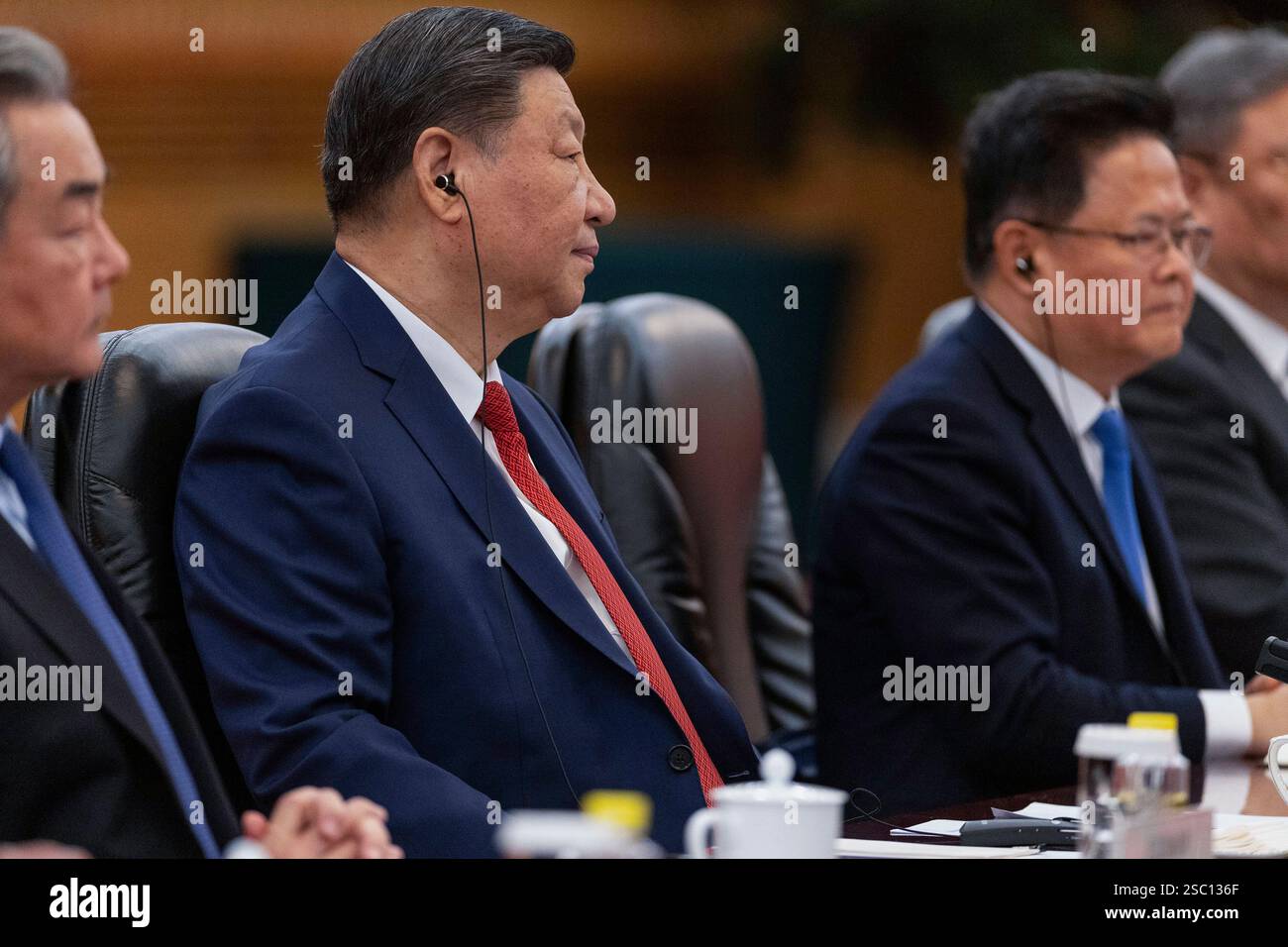 Chinese President Xi Jinping, second left, attends a meeting with ...