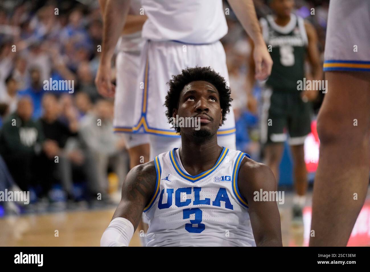 UCLA guard Eric Dailey Jr. (3) reacts from the ground during the second ...