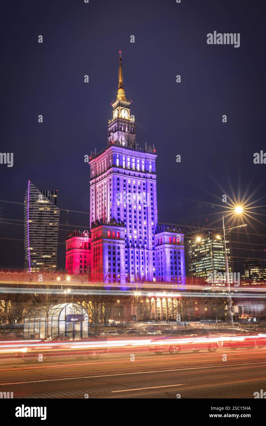 Warsaw Palace of Culture glows in red, white, and blue against the ...