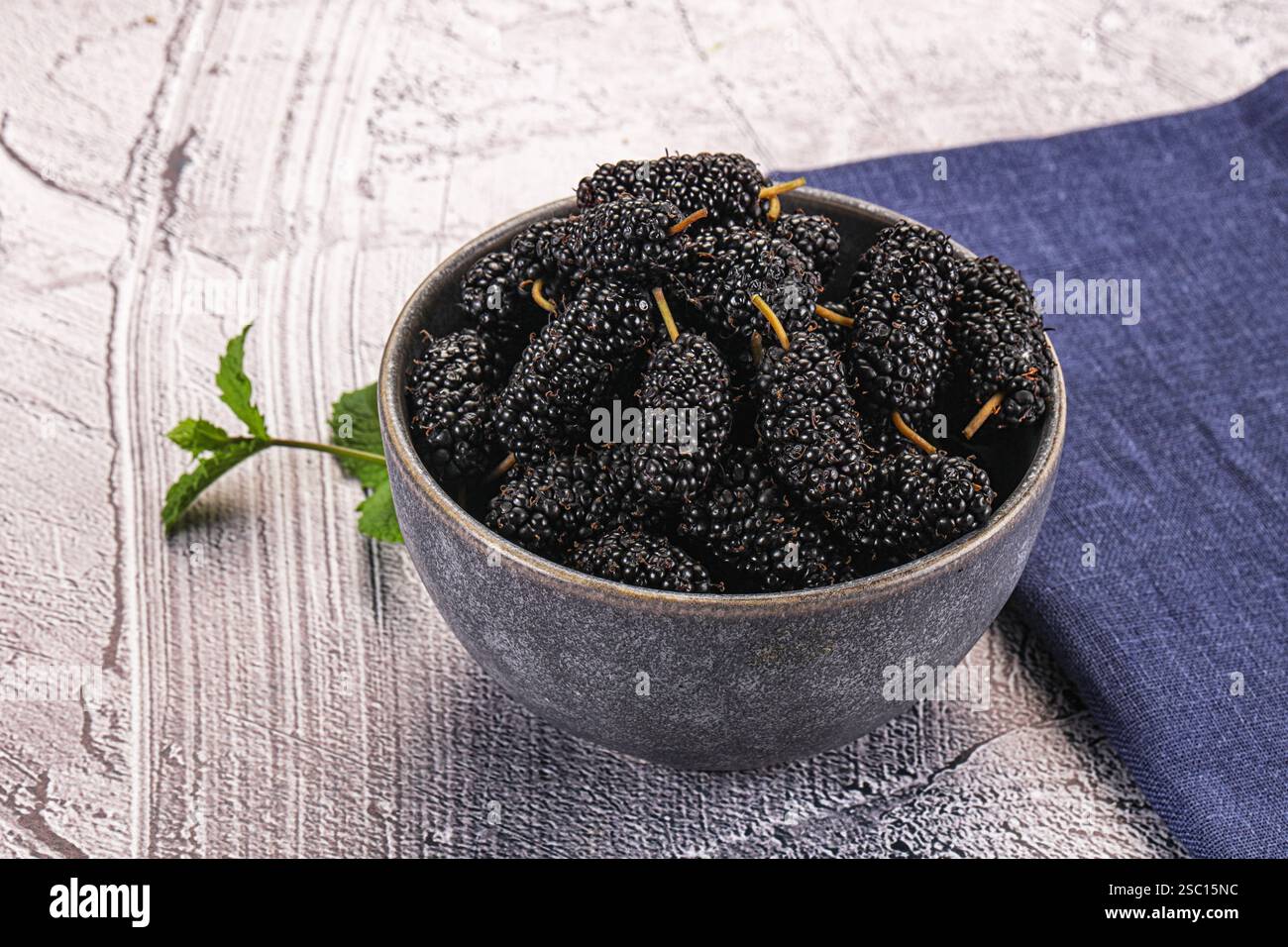 Juicy sweet black mulberry in the bowl Stock Photo - Alamy