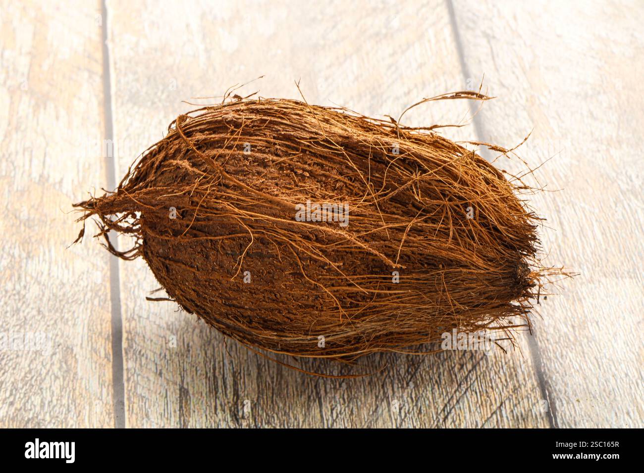 Natural exotic brown hairy coconut with shell Stock Photo - Alamy